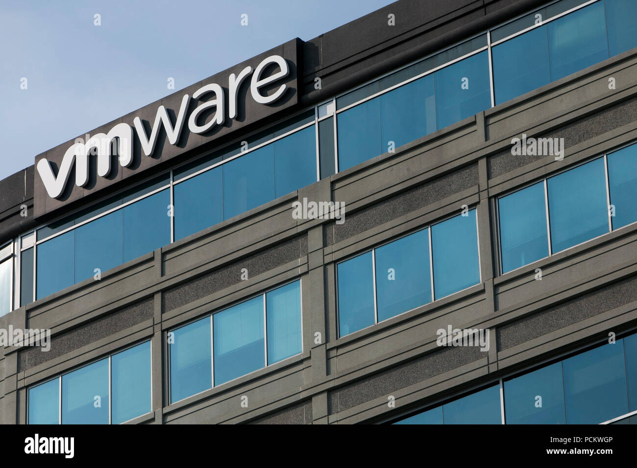 A logo sign outside of a facility occupied by VMware, Inc., in ...