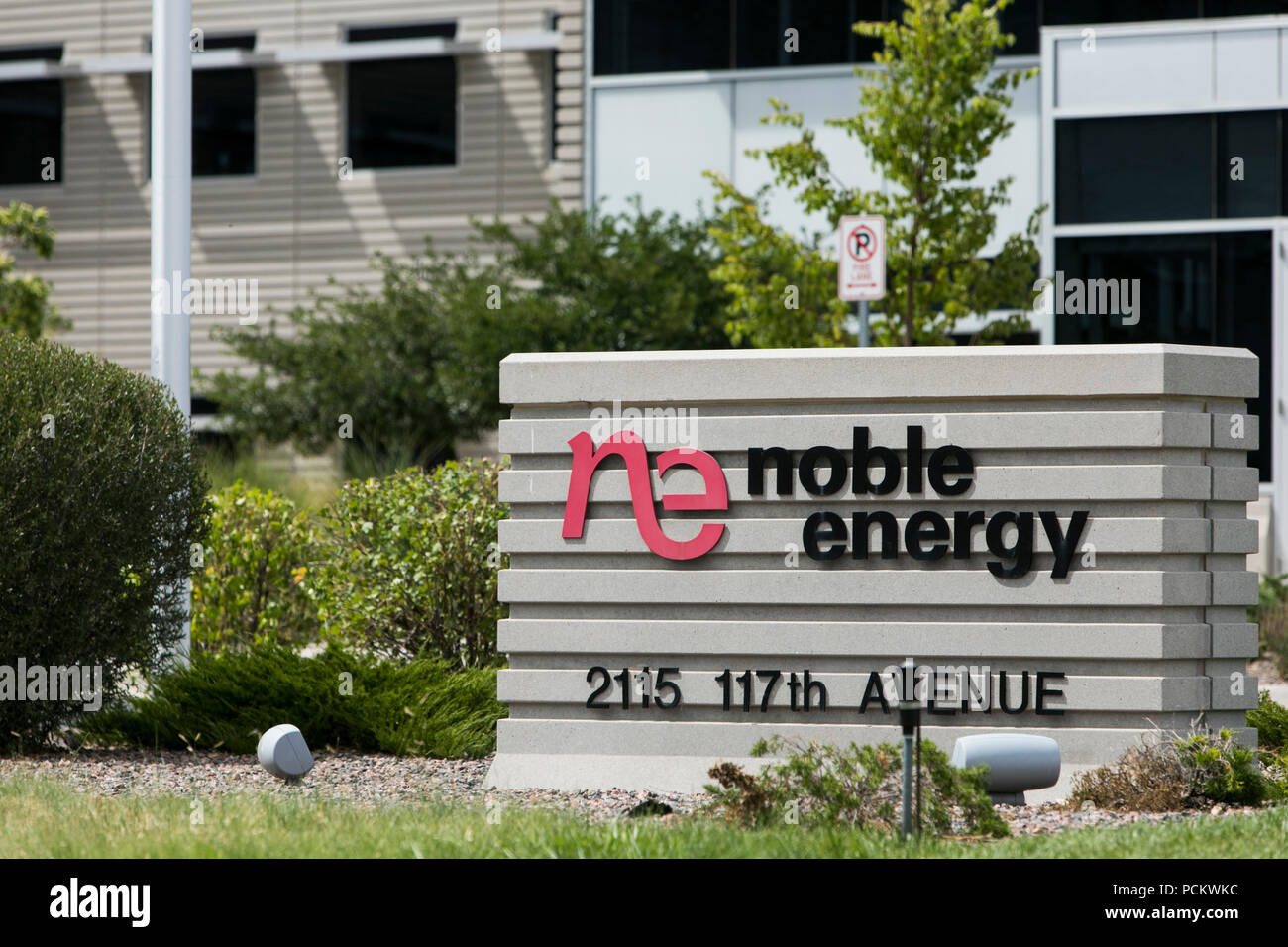 A logo sign outside of a facility occupied by Noble Energy, Inc., in ...