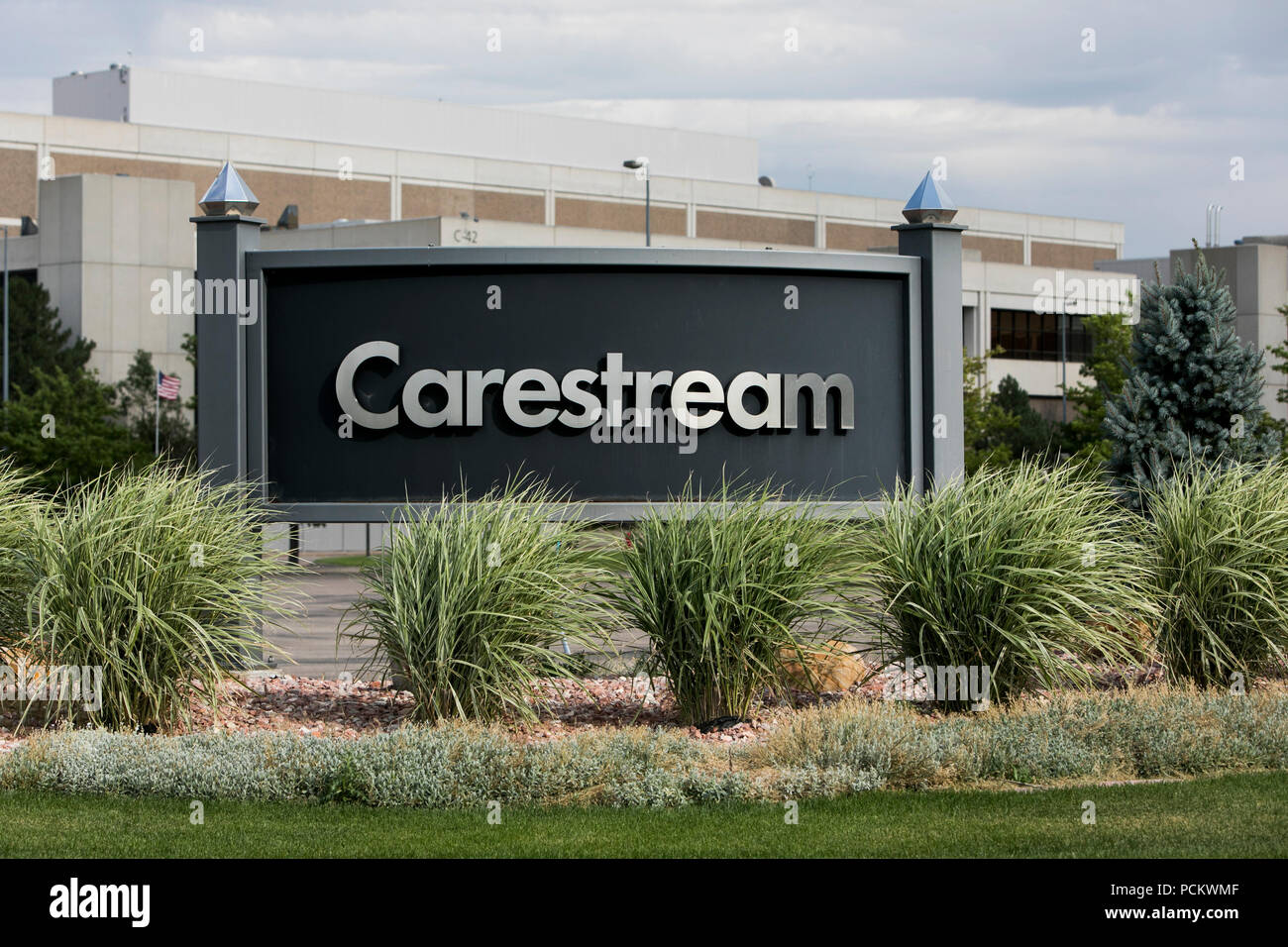 A logo sign outside of a facility occupied by Carestream Health, Inc ...