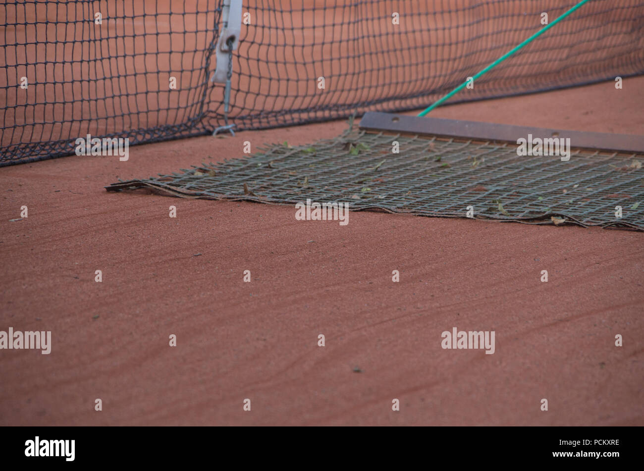 Clean sweeping a tennis court Stock Photo - Alamy