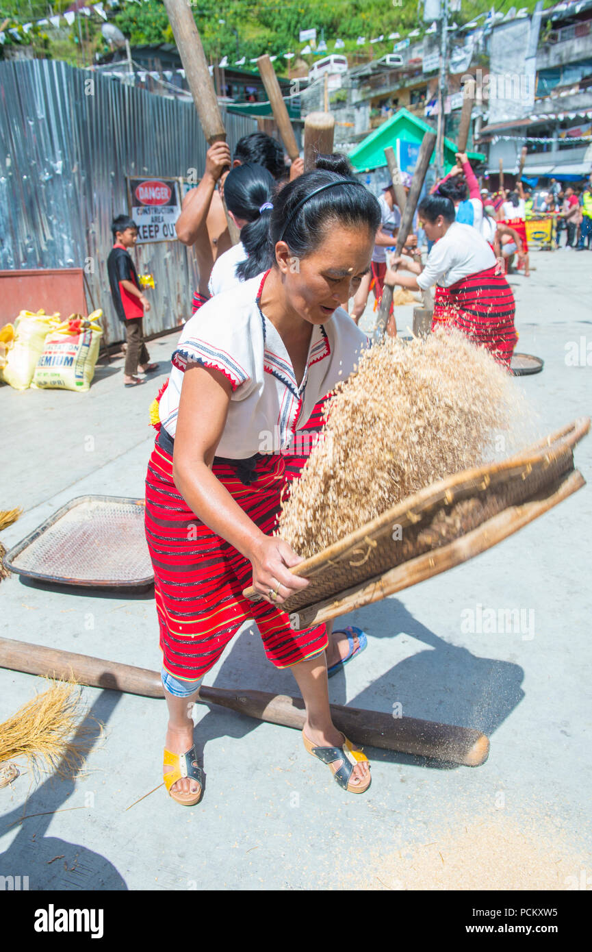 Woman from Ifugao Minority in a rice pounding competion during Imbayah ...