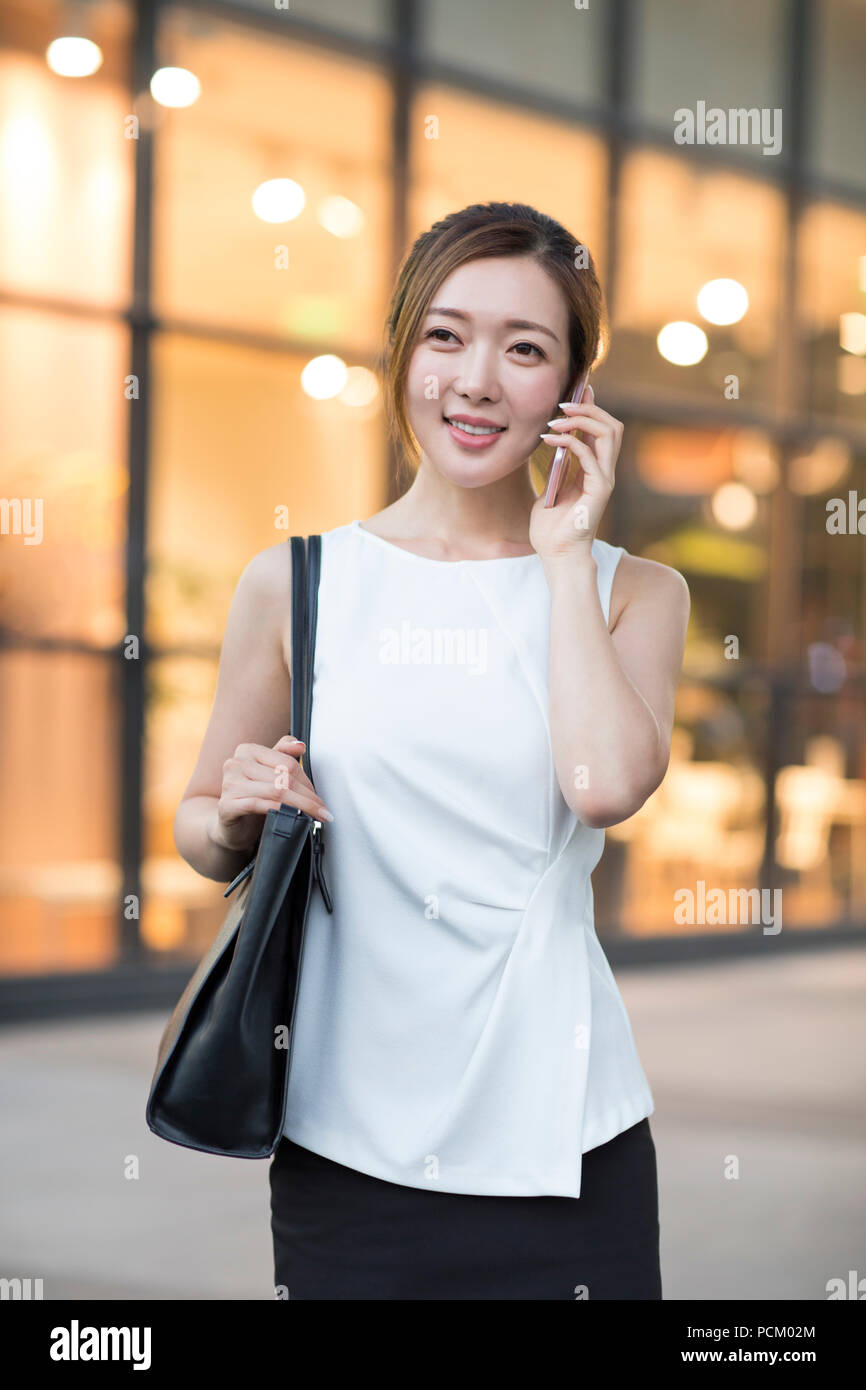 Confident asian businesswoman talking on hi-res stock photography and images - Alamy
