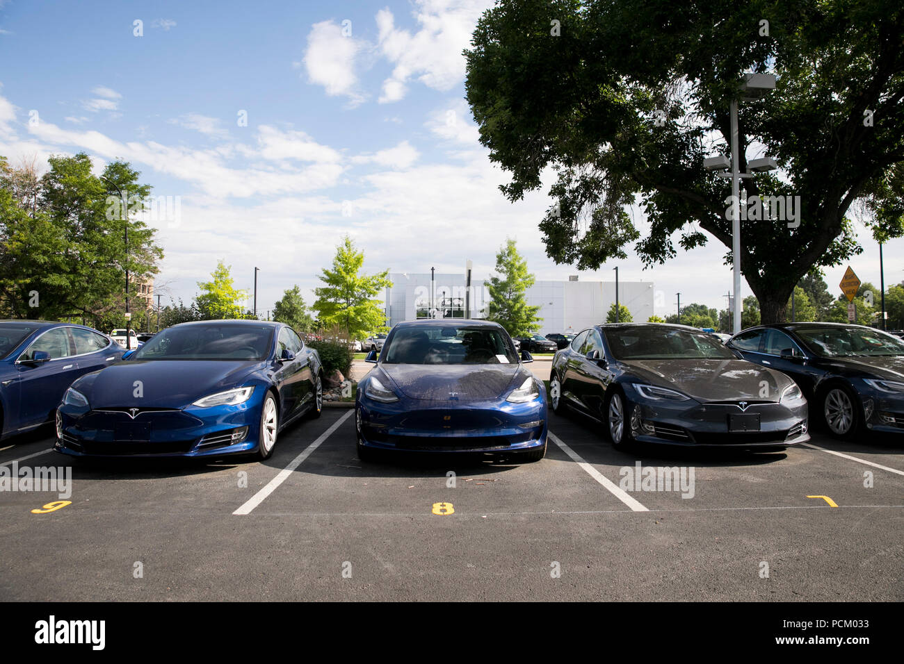 Tesla Model S and Model 3 electric vehicles at a Tesla Store location ...