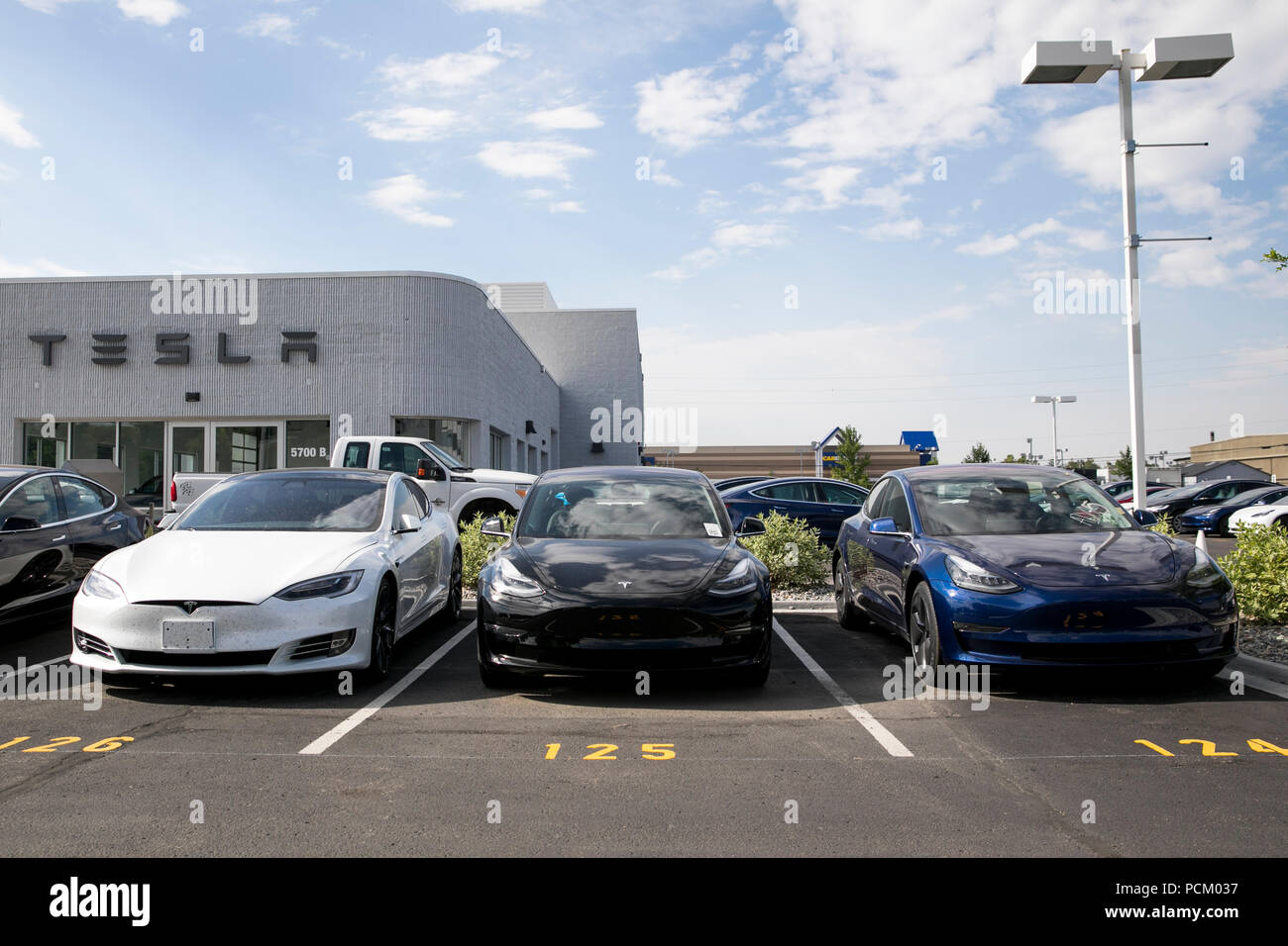 Tesla Model S and Model 3 electric vehicles at a Tesla Store location ...