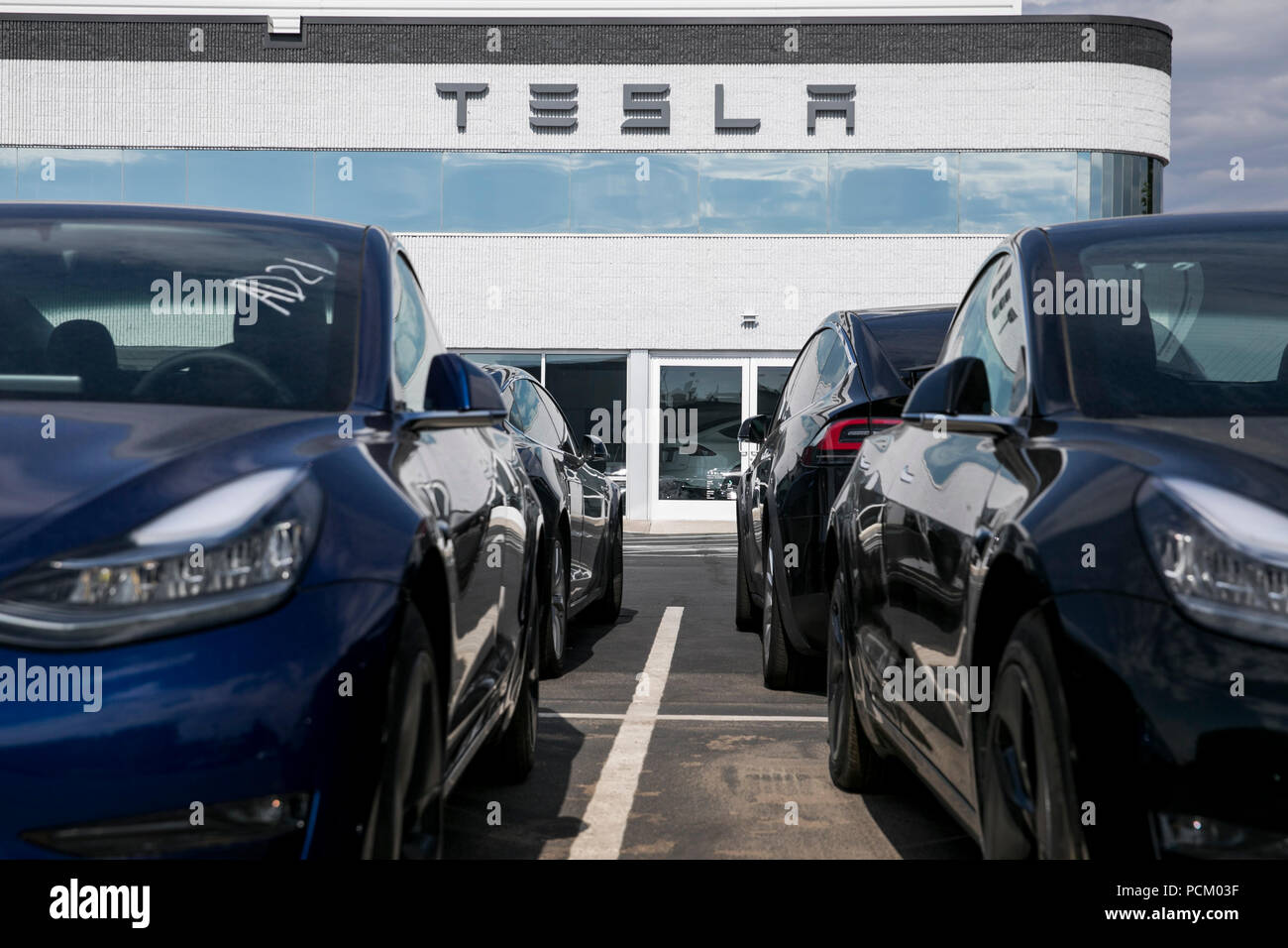 Tesla Model 3 electric vehicles at a Tesla Store location in Littleton ...