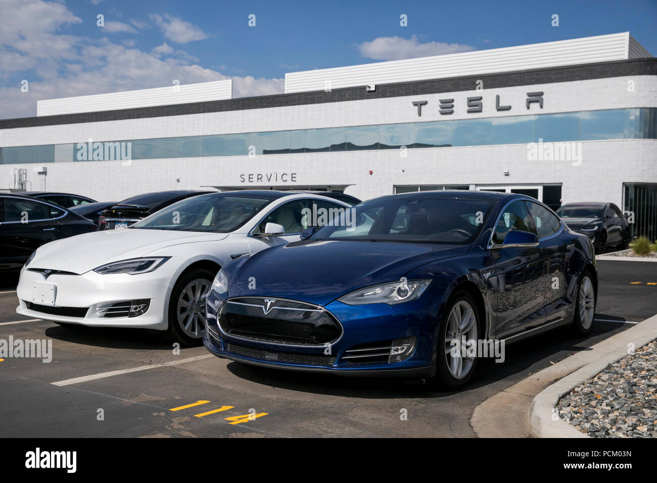 Tesla Model S and Model 3 electric vehicles at a Tesla Store location ...