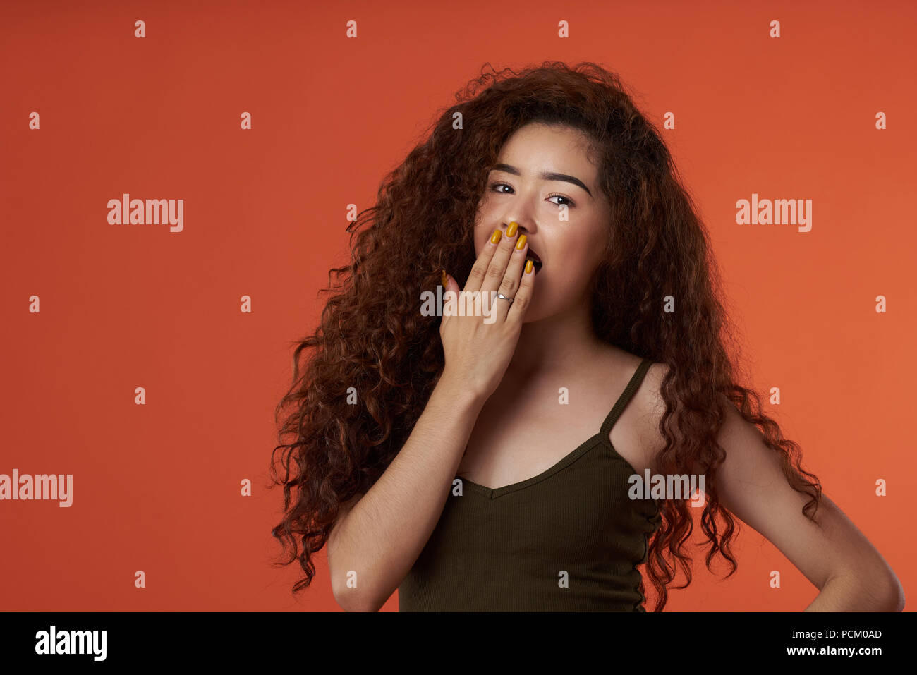 Yawning woman covering mouth hand hi-res stock photography and images ...
