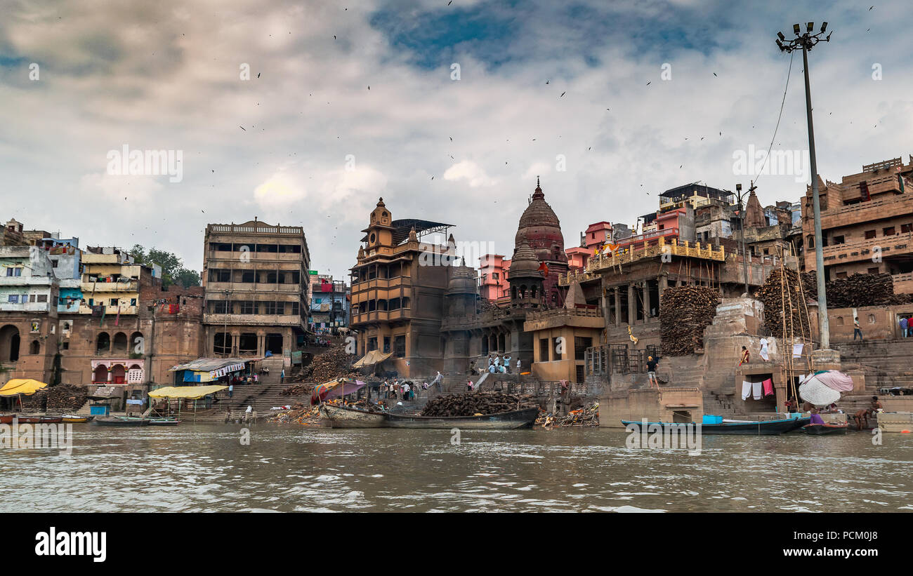 A view from River Ganges of Old Historical Varanasi city with weathered ...