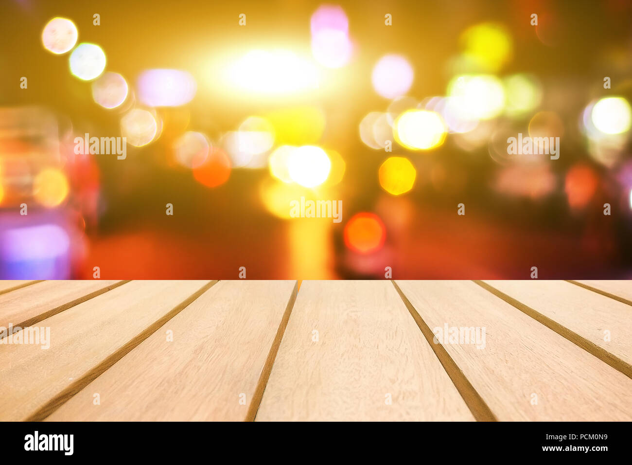 Wooden table and beautiful background montage Stock Photo - Alamy
