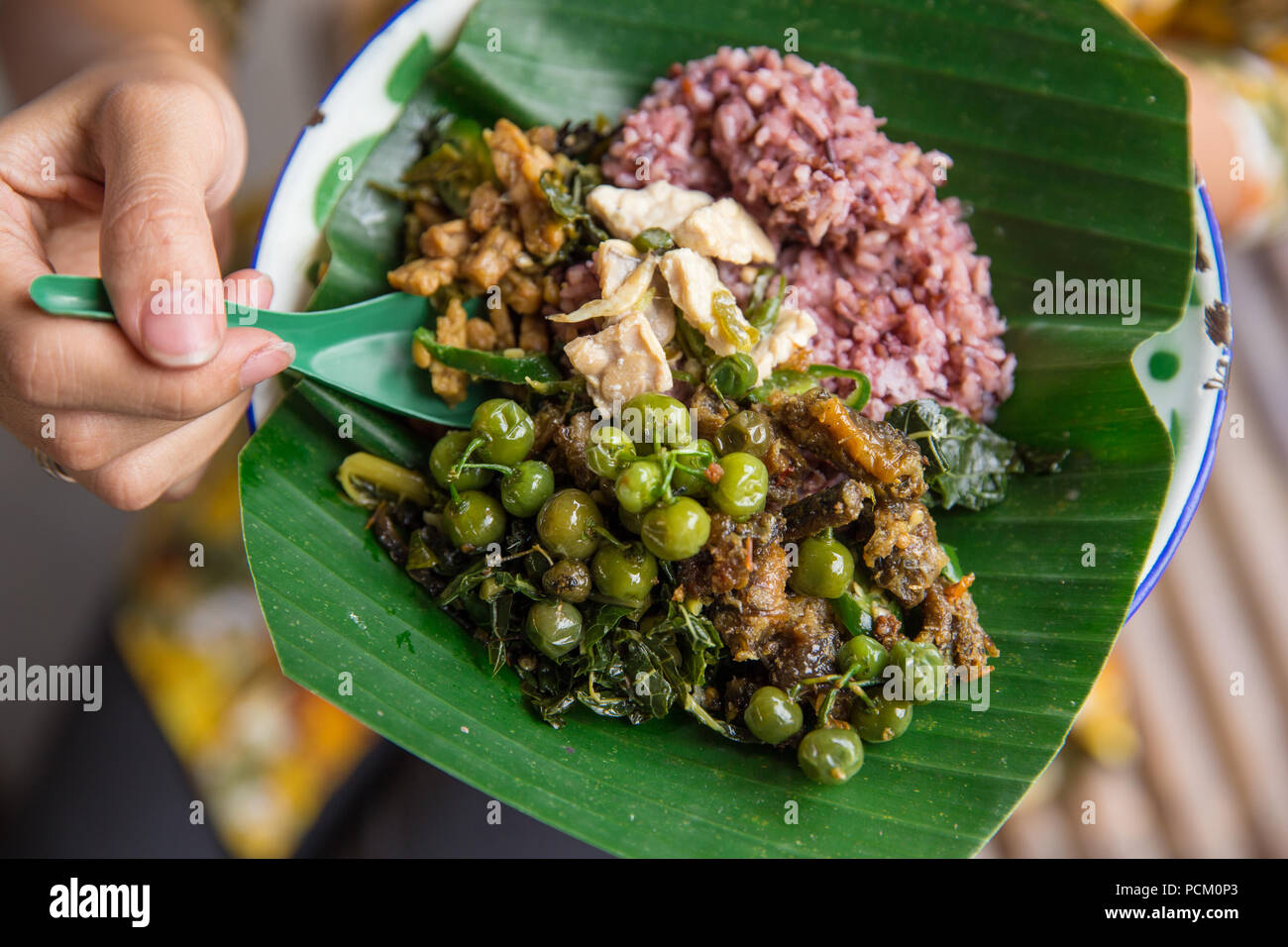 red or brown rice in traditional javanese indonesian culinary served ...