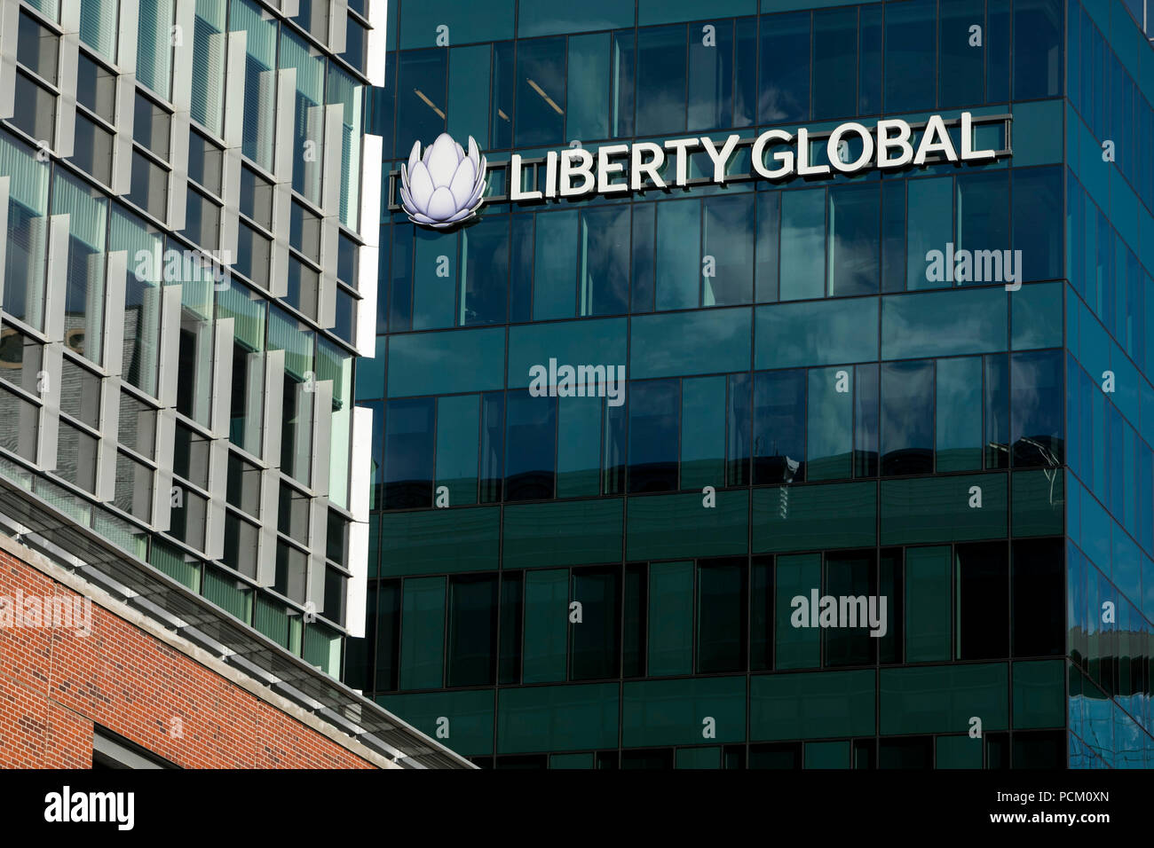 A logo sign outside of a facility occupied by Liberty Global in Denver ...