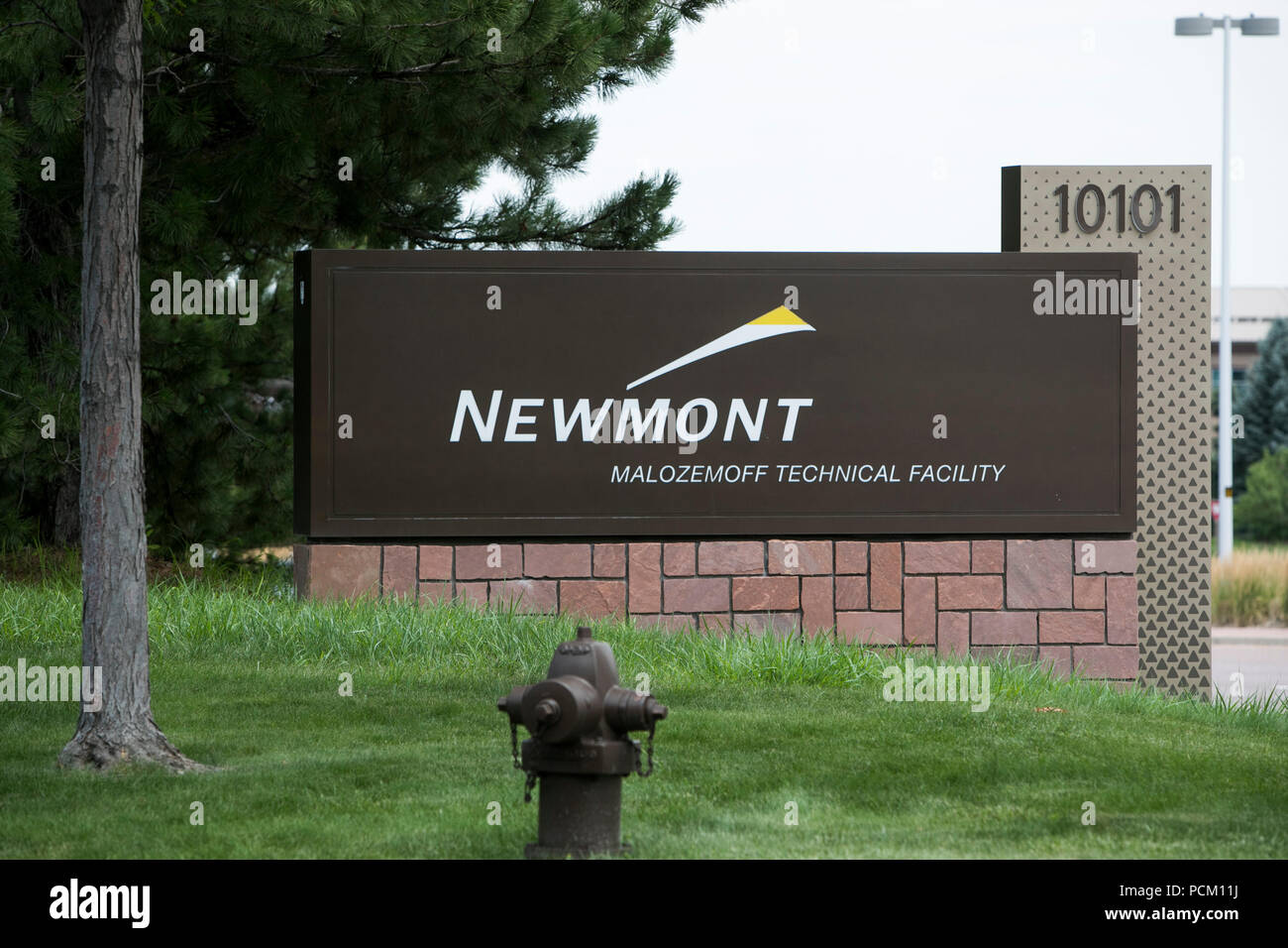 A logo sign outside of a facility occupied by the Newmont Mining ...