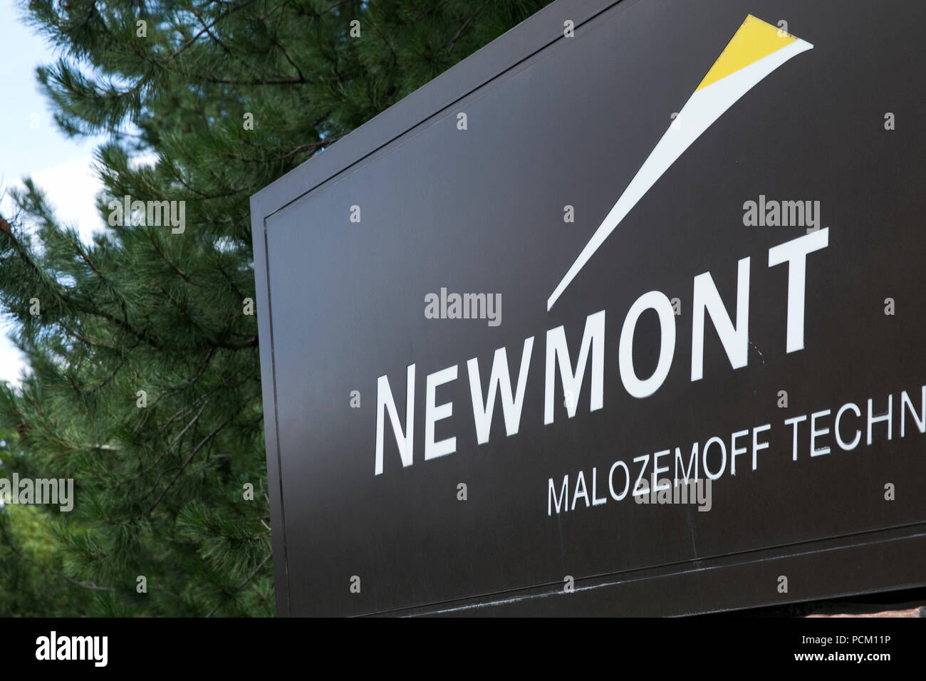 A logo sign outside of a facility occupied by the Newmont Mining ...