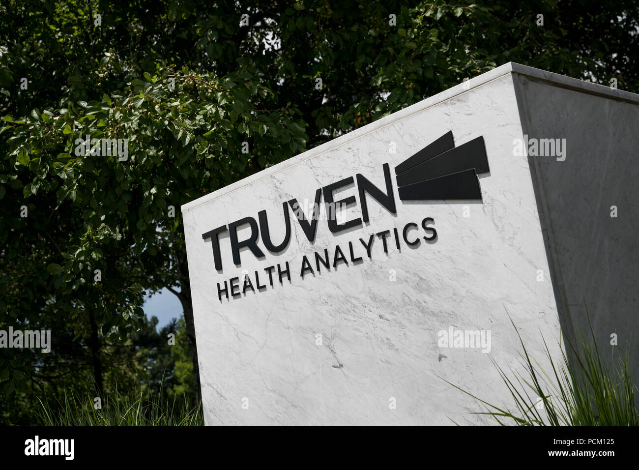 A logo sign outside of a facility occupied by Truven Health Analytics ...