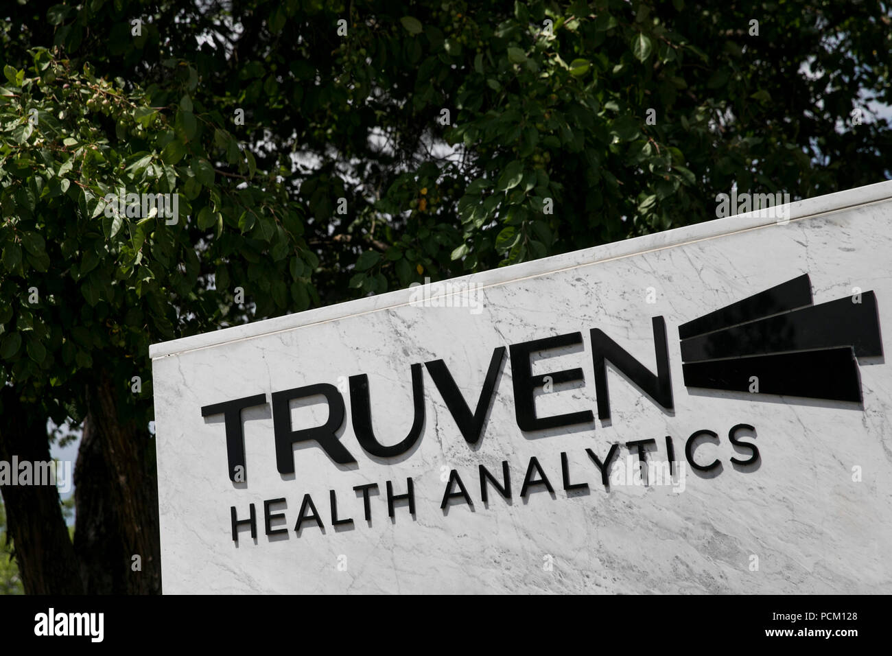 A logo sign outside of a facility occupied by Truven Health Analytics ...