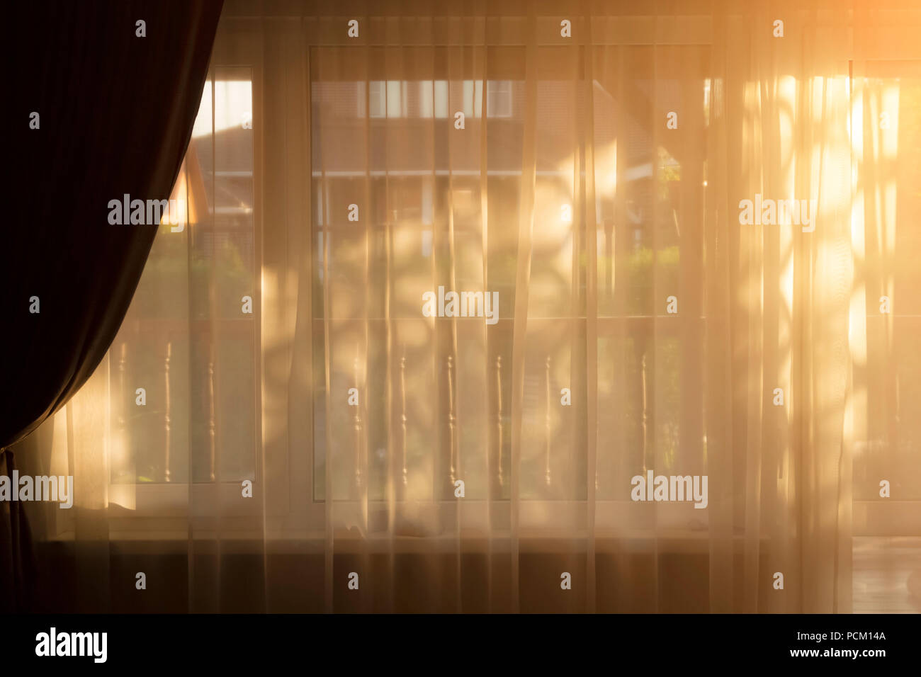 Sunset through curtains hi-res stock photography and images - Alamy