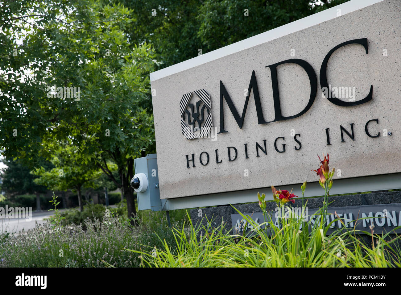 A logo sign outside of the headquarters of MDC Holdings in Denver ...