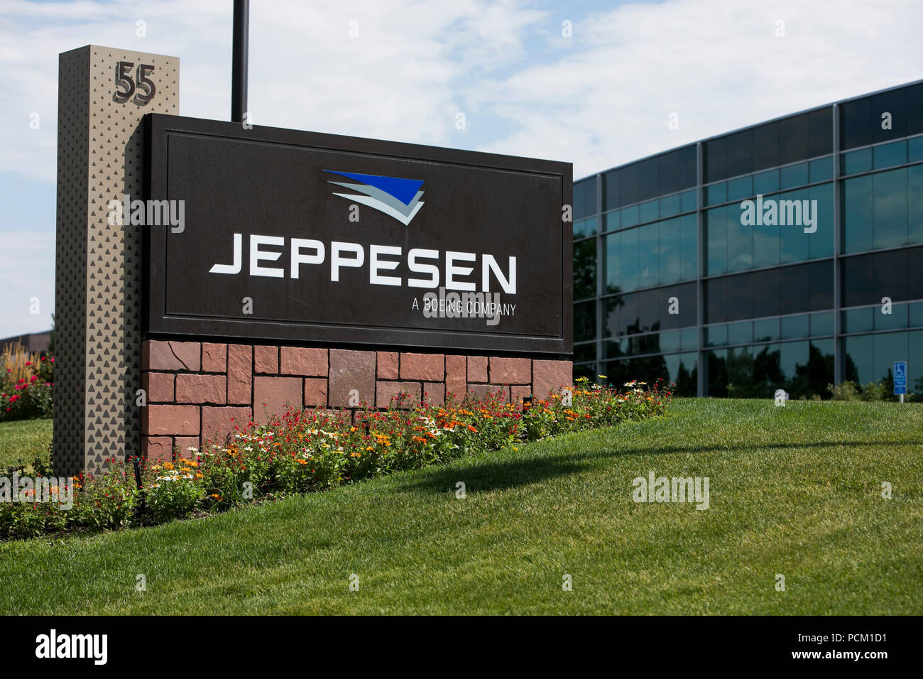 A logo sign outside of the headquarters of Jeppesen in Englewood ...