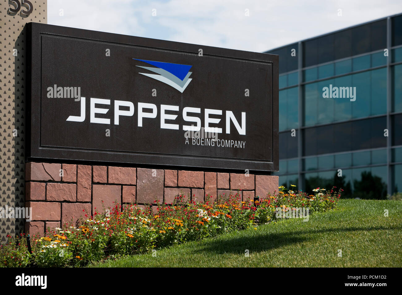 A logo sign outside of the headquarters of Jeppesen in Englewood ...