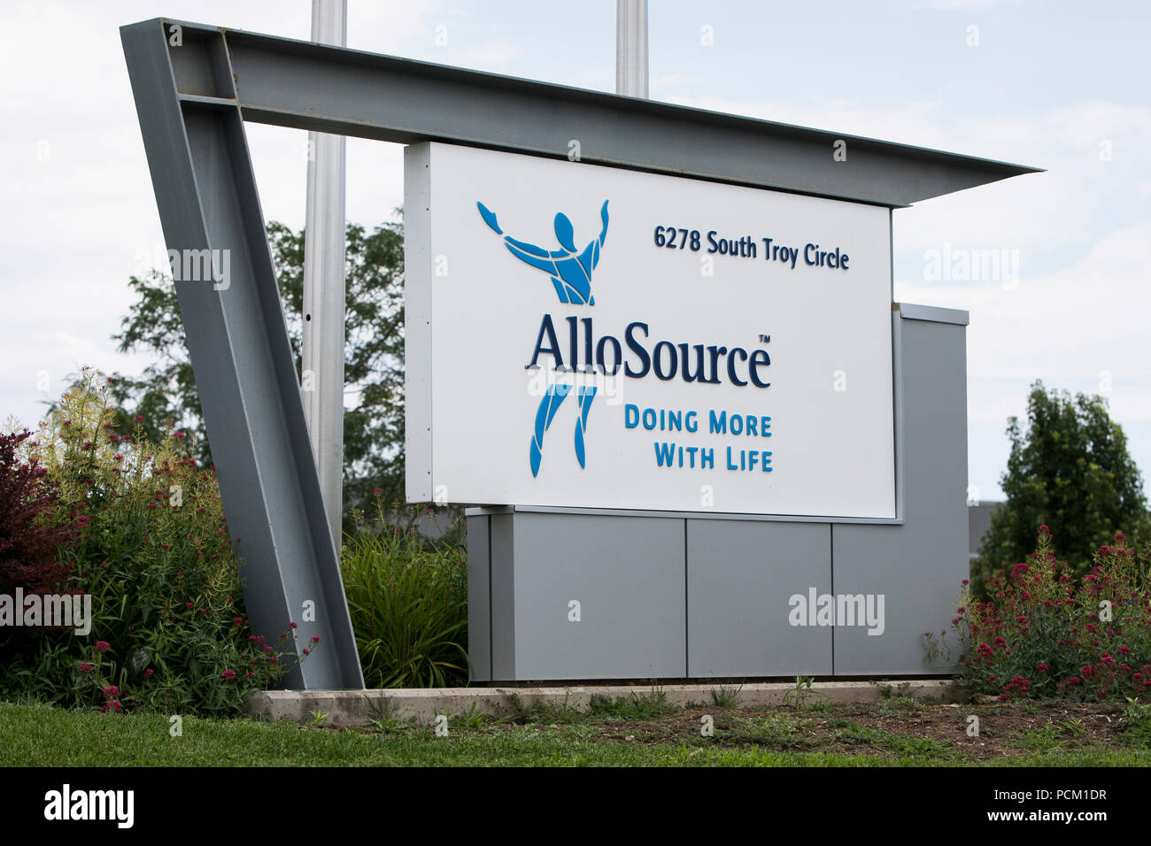 A logo sign outside of the headquarters of AlloSource in Centennial ...
