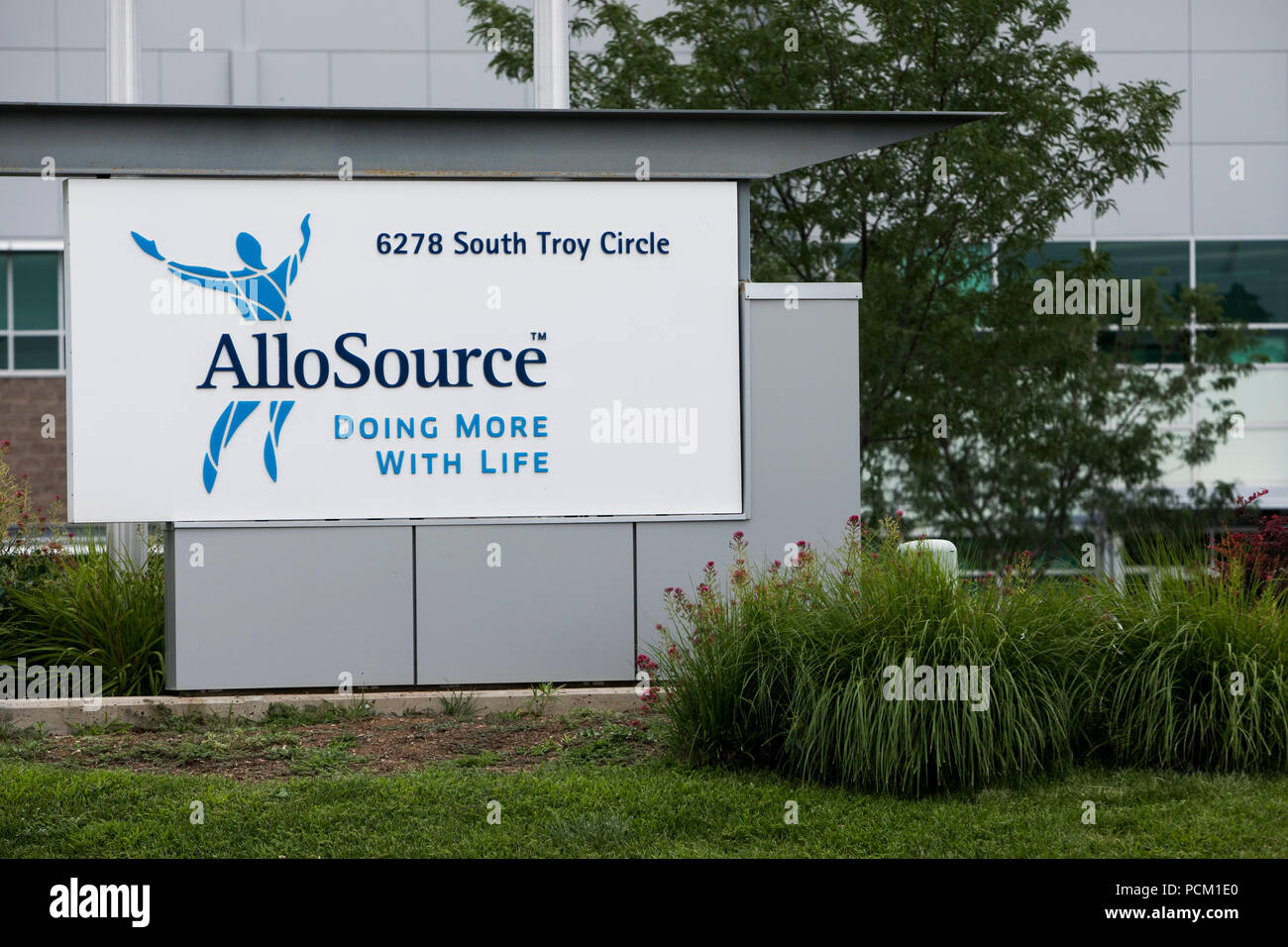 A logo sign outside of the headquarters of AlloSource in Centennial ...
