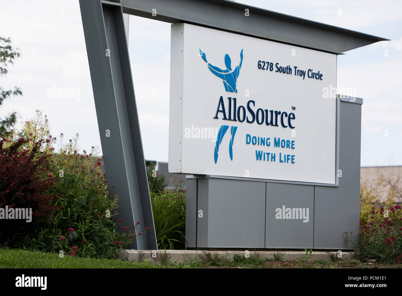 A logo sign outside of the headquarters of AlloSource in Centennial ...