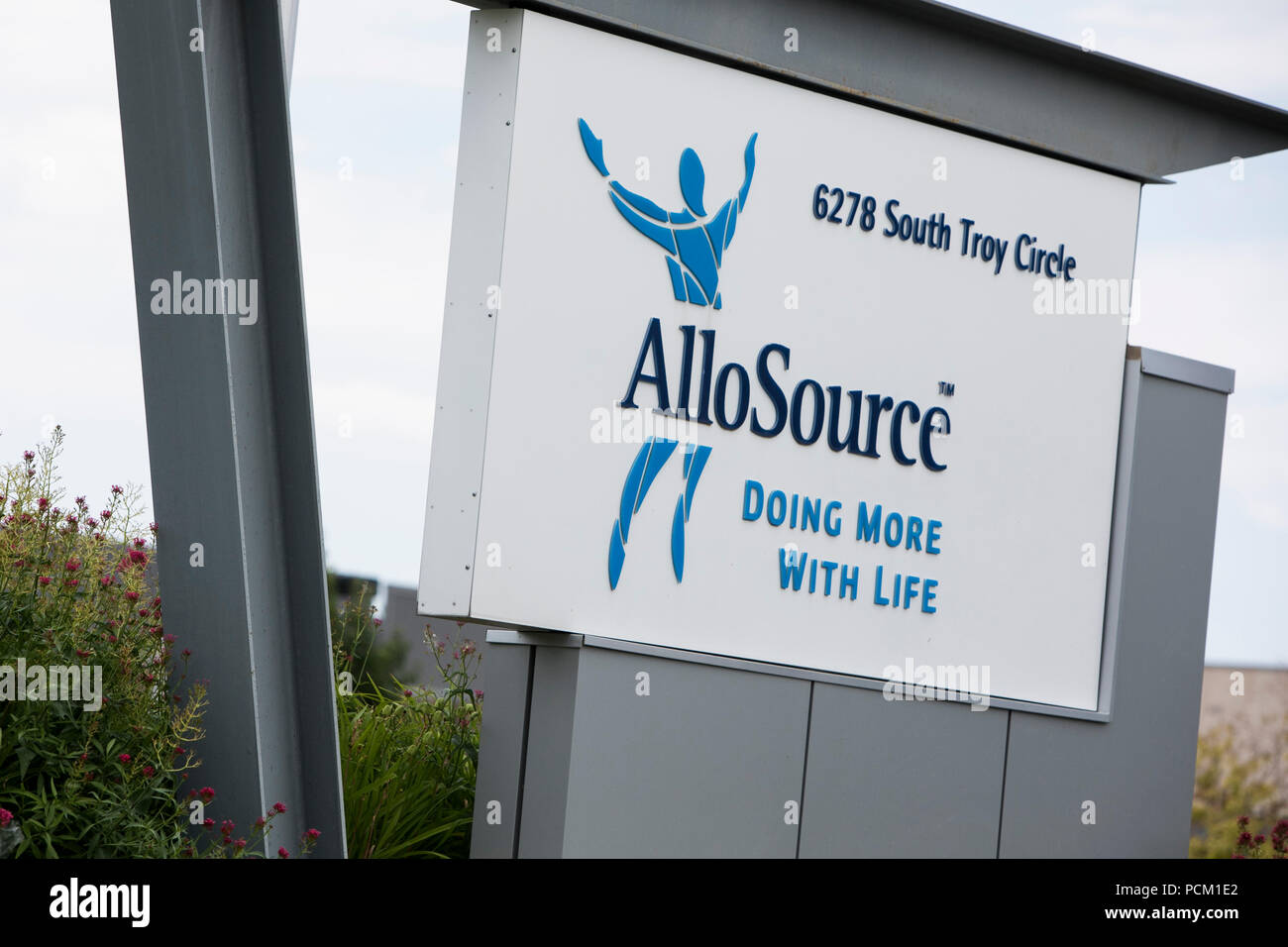 A logo sign outside of the headquarters of AlloSource in Centennial ...