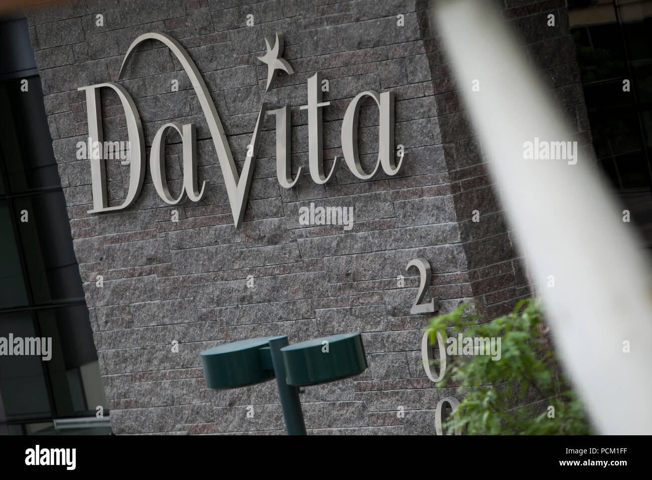 A logo sign outside of the headquarters of DaVita, Inc., in Denver ...