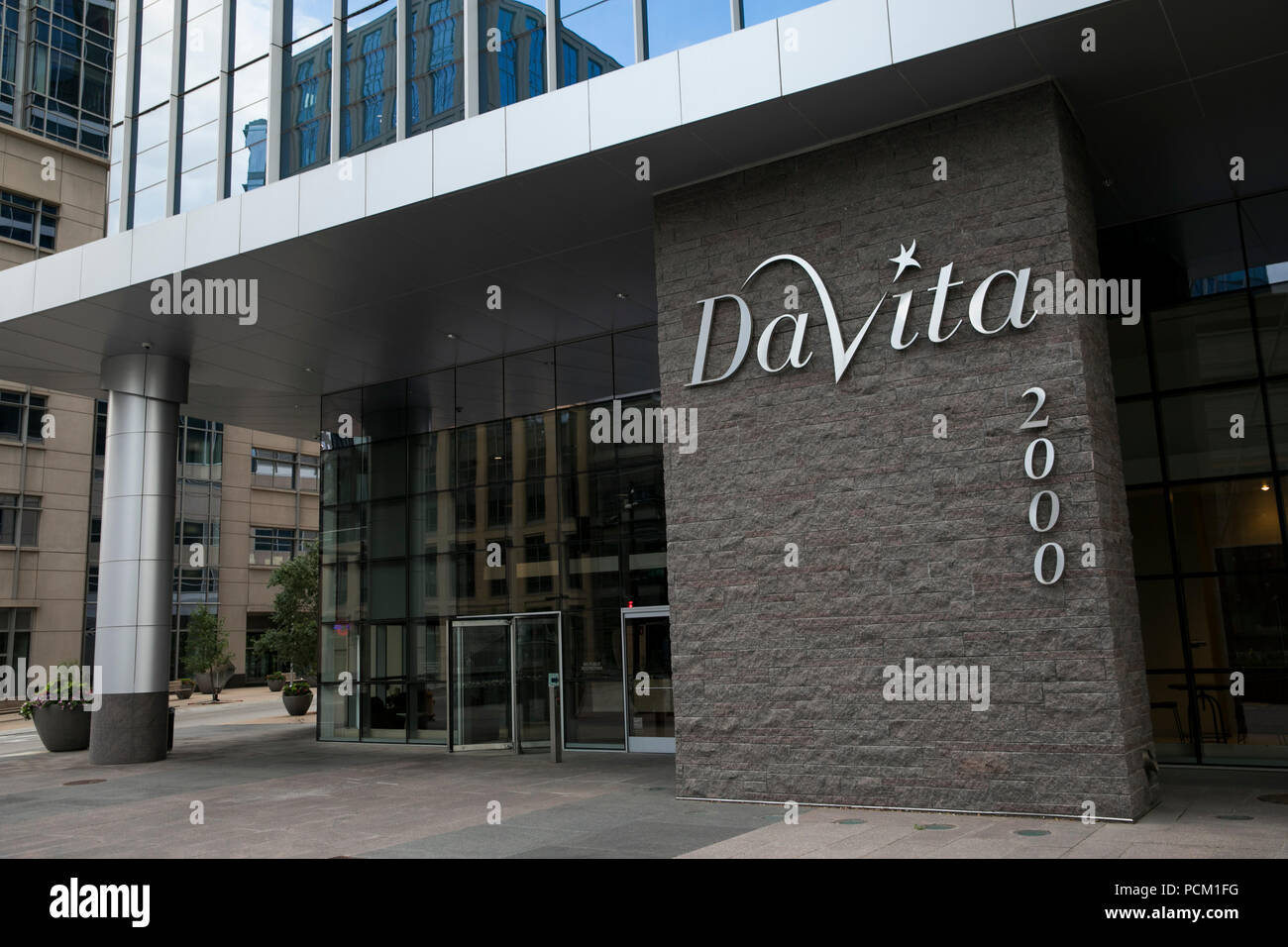 A logo sign outside of the headquarters of DaVita, Inc., in Denver ...