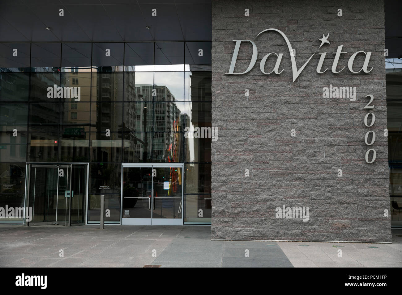 A logo sign outside of the headquarters of DaVita, Inc., in Denver ...