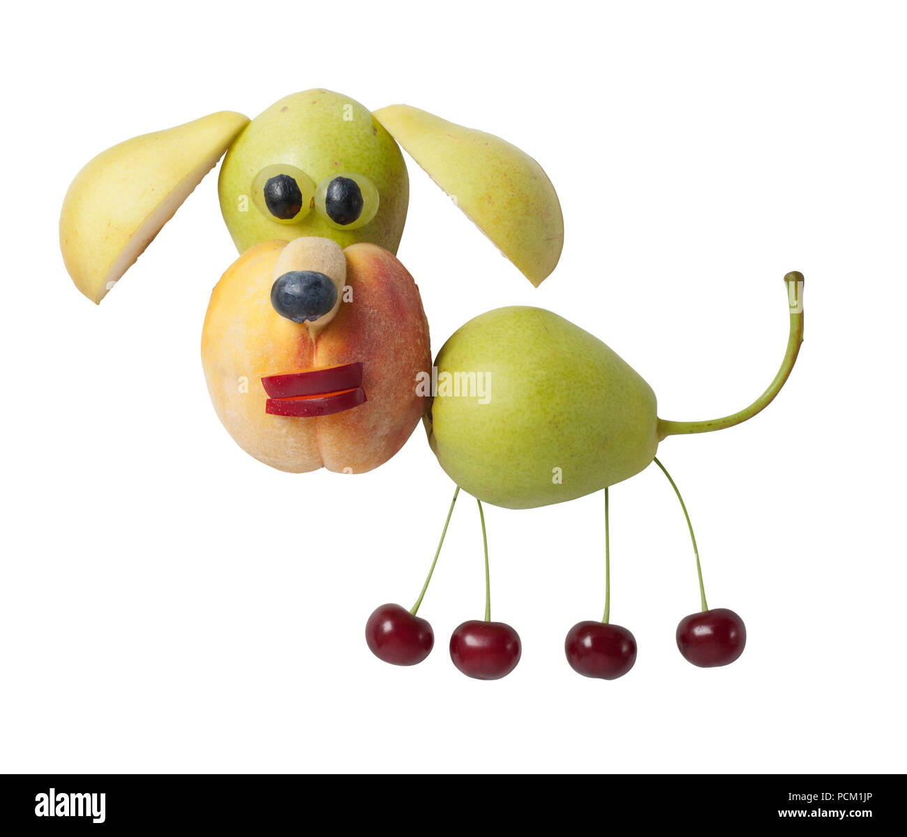 Idea of making a dog from fresh fruits Stock Photo - Alamy