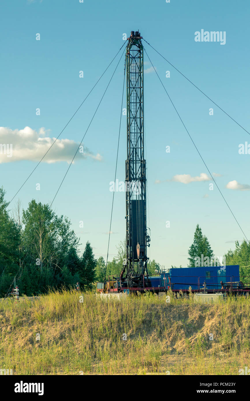 The drilling tower on the stretches surrounded by a sandy shaft Stock ...