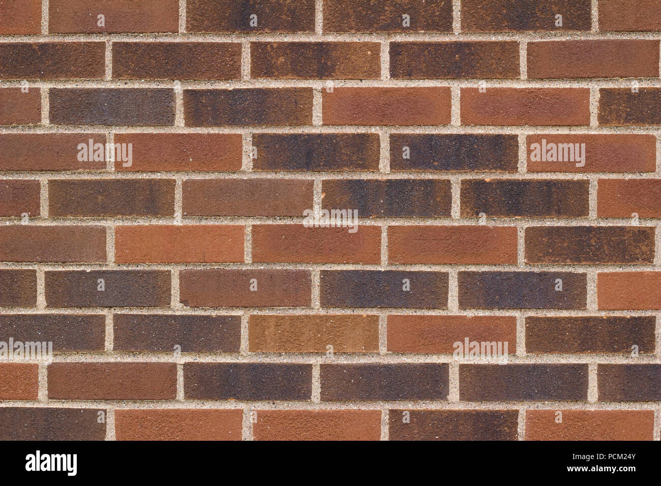 Colorful traditional brown clay brick wall background in varying shades ...