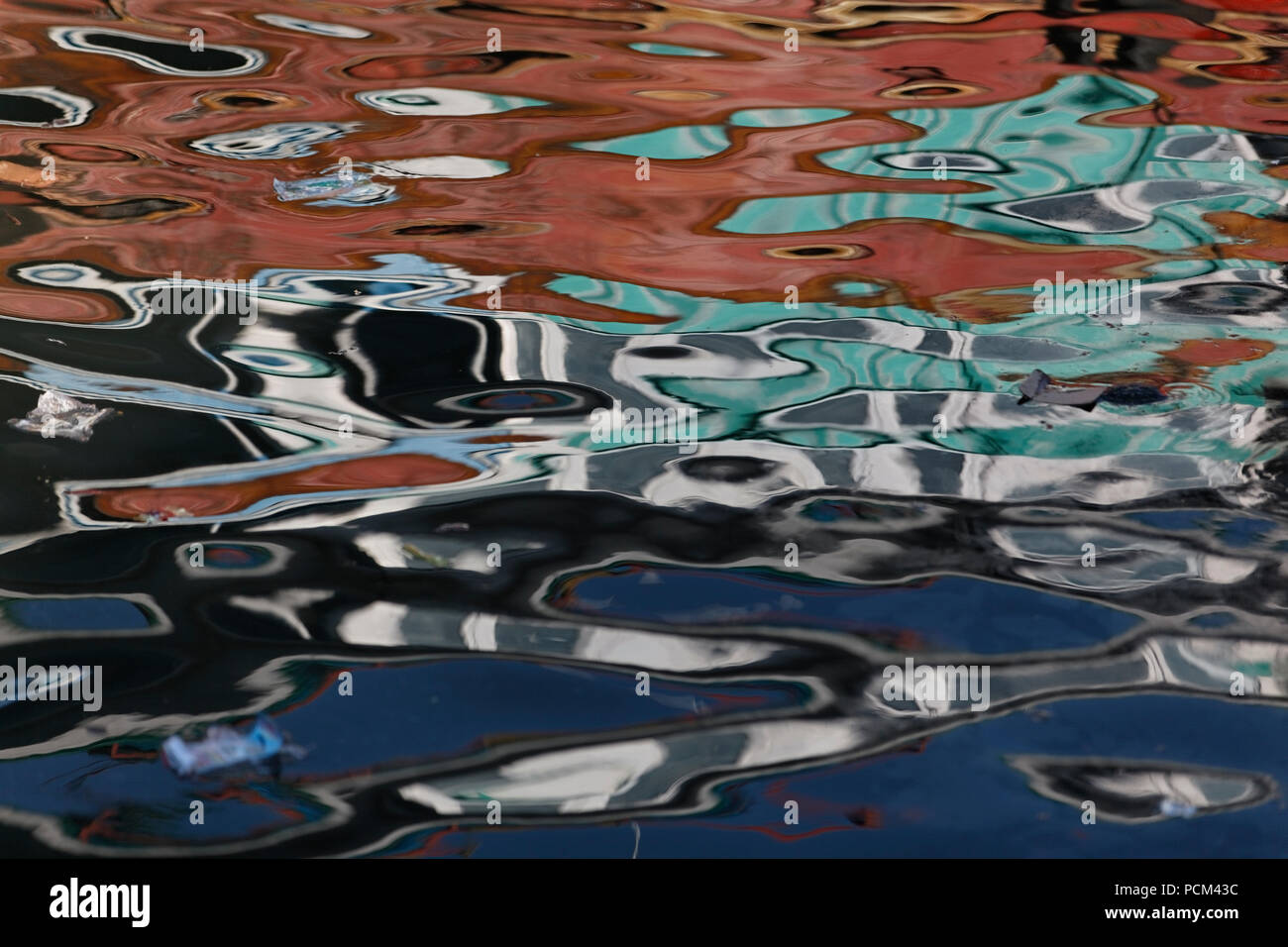 Abstract reflection of boats in water Stock Photo - Alamy