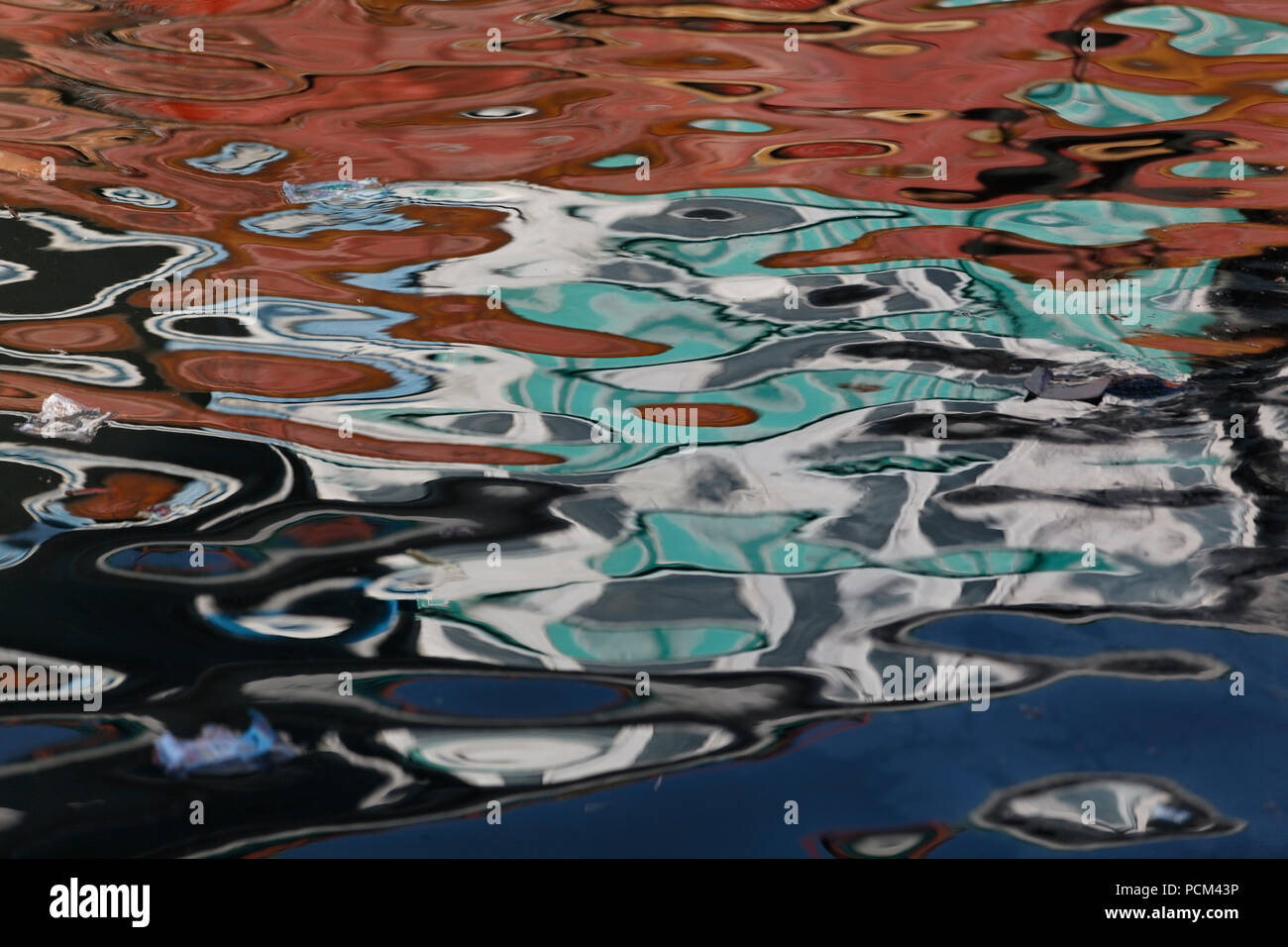 Abstract reflection of boats in water Stock Photo - Alamy