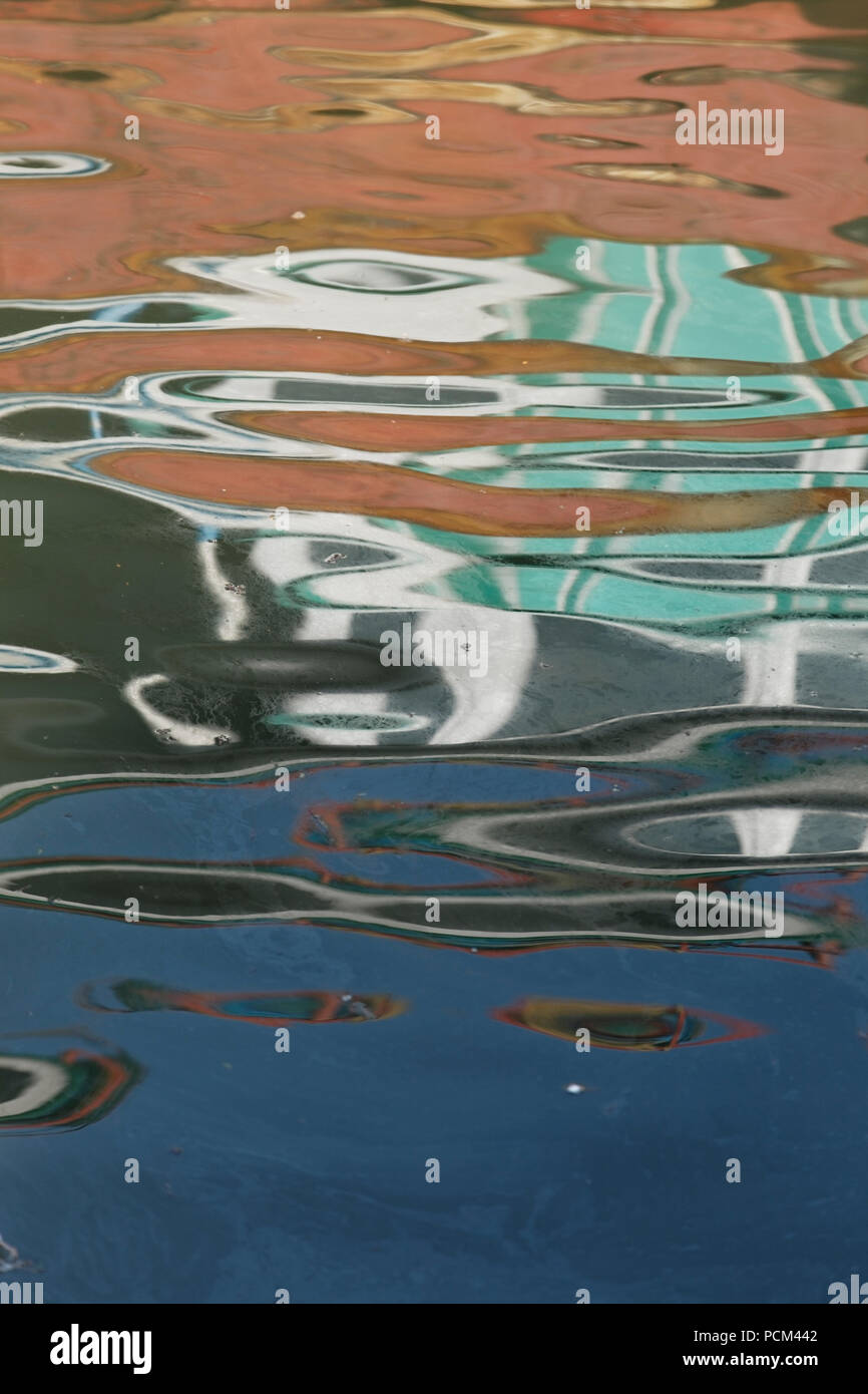 Abstract reflection of boats in water Stock Photo - Alamy
