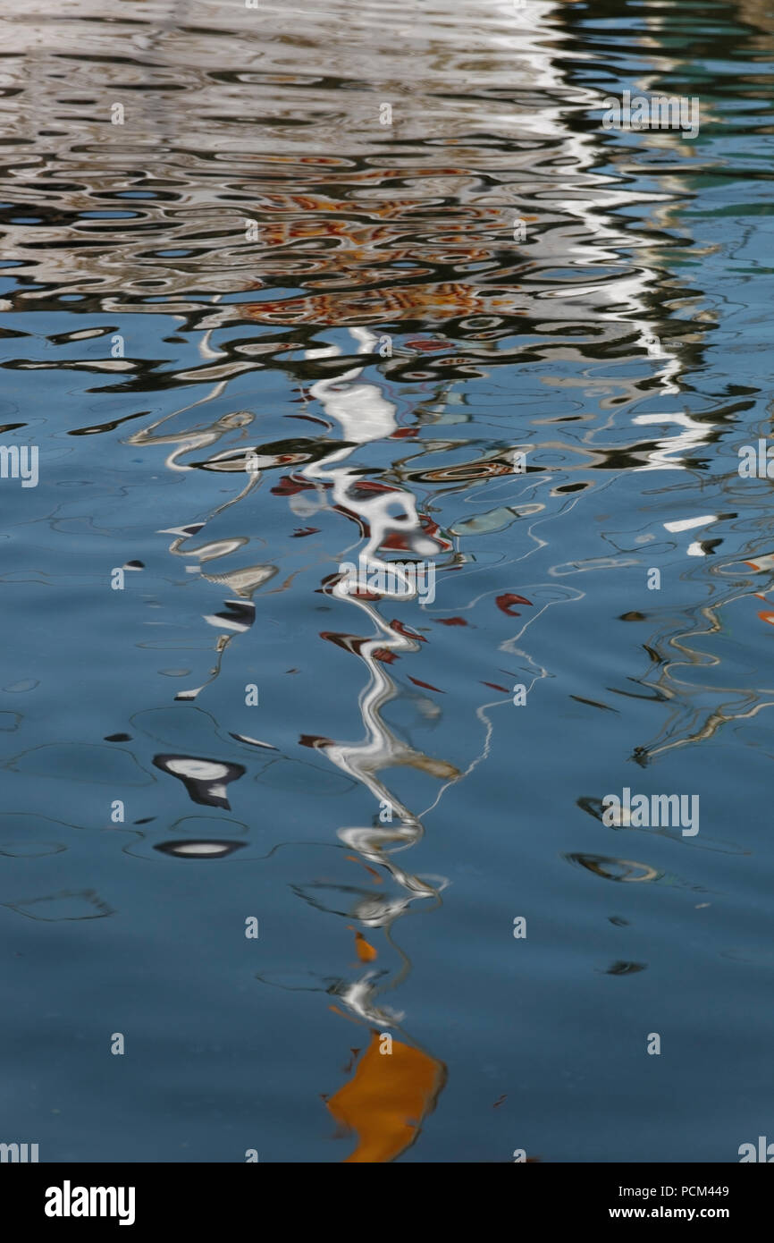 Abstract reflection of boats in water Stock Photo - Alamy