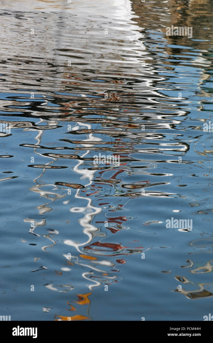 Abstract reflection of boats in water Stock Photo - Alamy