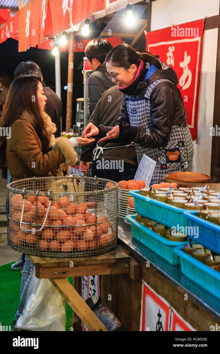 Shogatsu, new year at Nishinomiya shrine, Japan. Women stall holder ...