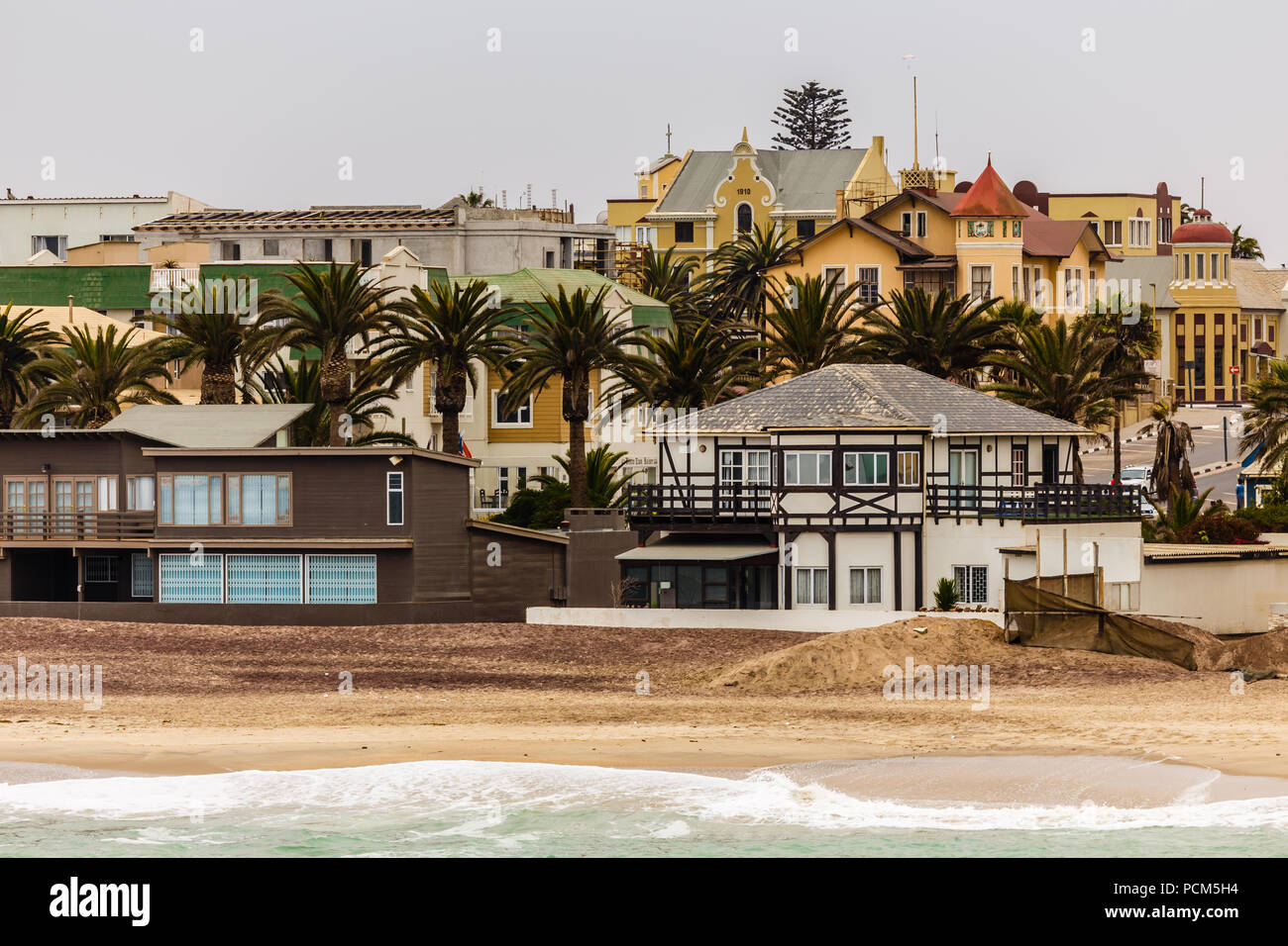 Coastline, palms and old blocks of Swakopmund German colonial town ...