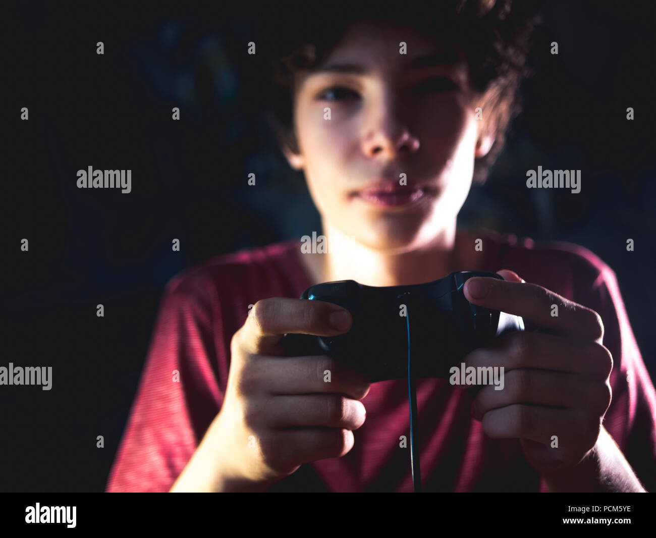 Teen boy computer game bedroom hi-res stock photography and images - Alamy