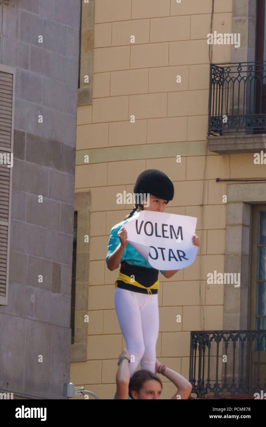 people building a human pyramid during the festival in catalunya, spain ...