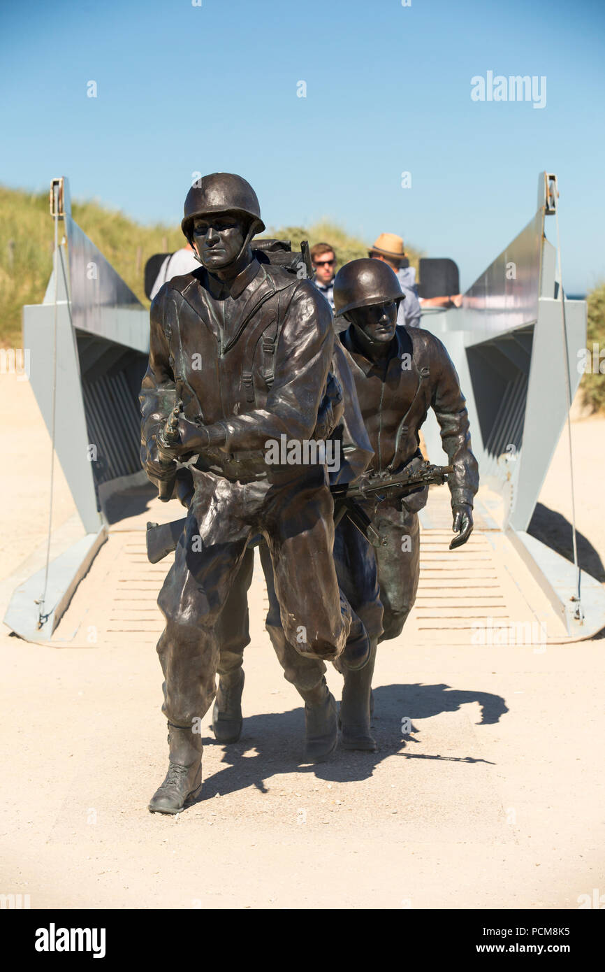 A memerial and sculptures of landing crafts and soldiers at the Utah ...