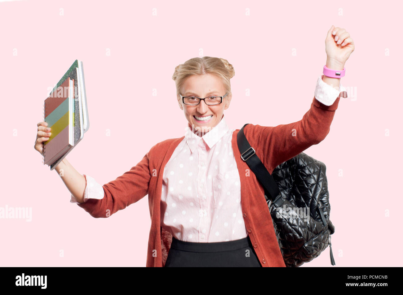 Happy young student girl holding books, high school or college graduand ...