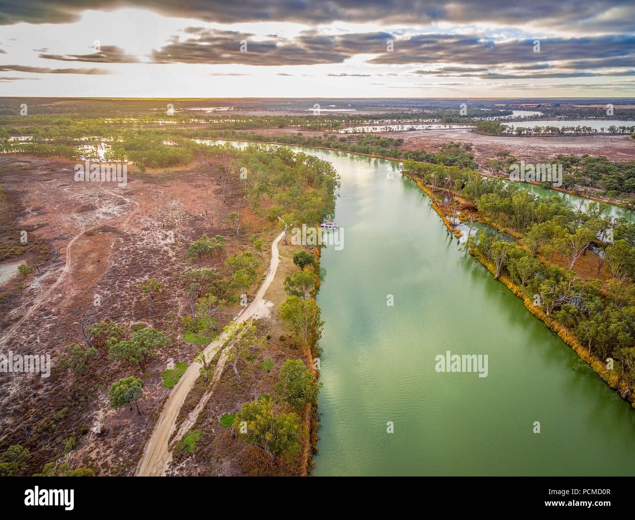 Aerial view of majestic Murray River flowing among islands of gum trees ...