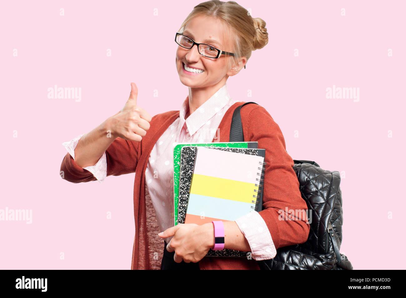 Happy young student girl holding books, high school or college graduand ...