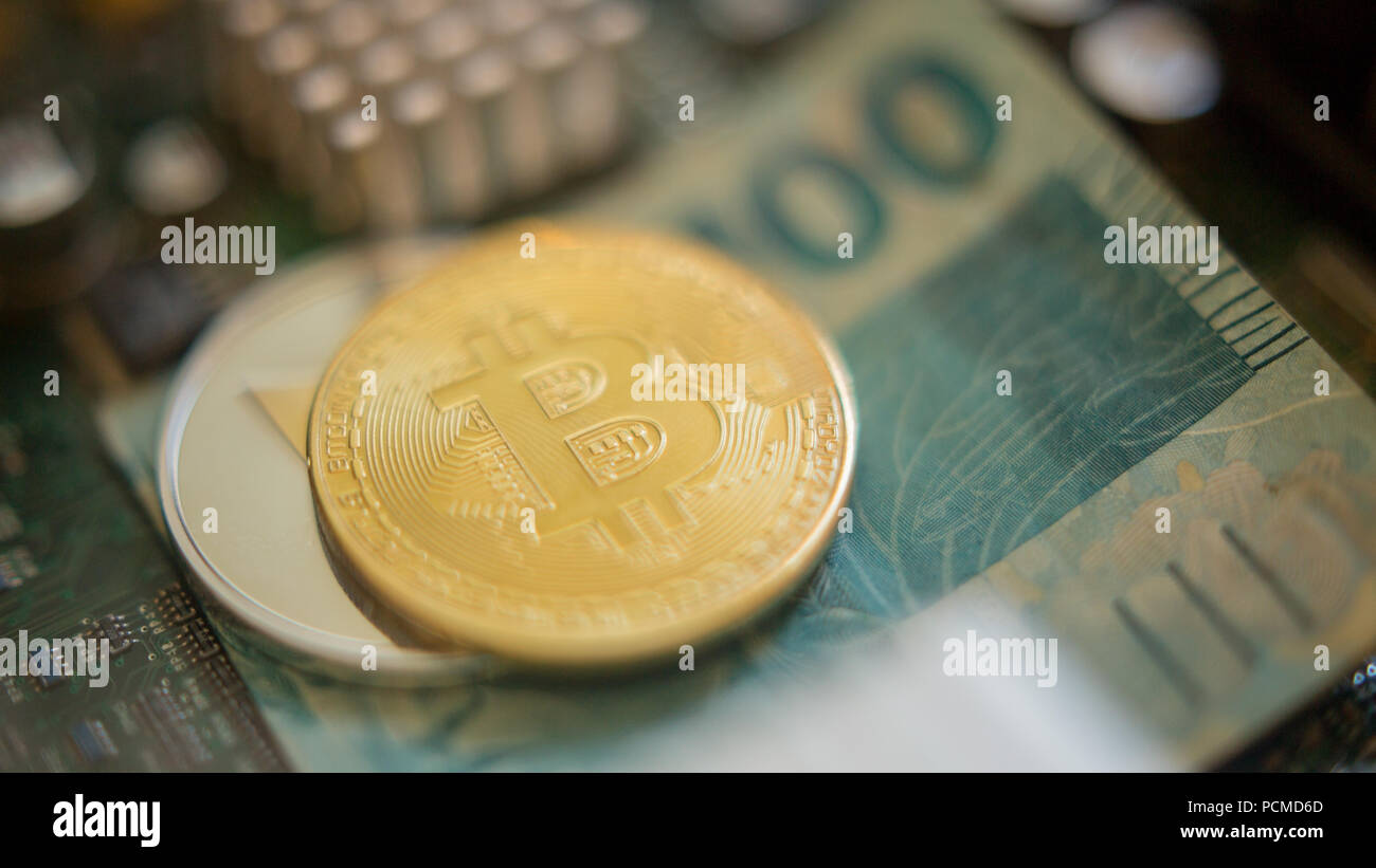 Metal Bitcoins and Ethereum coins. Bitcoin, Ethereum - modern virtual ...