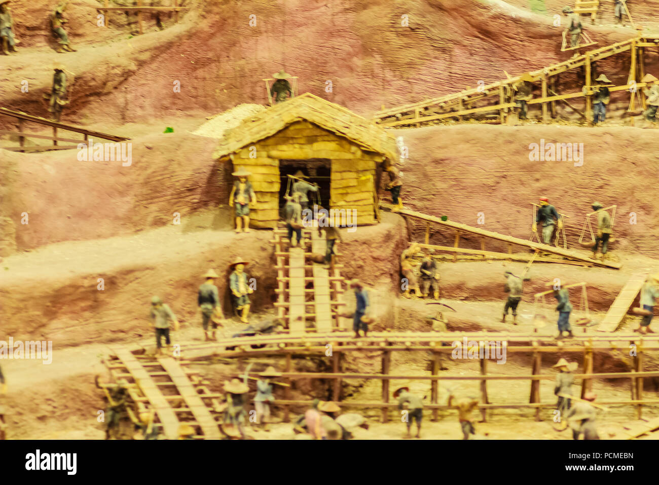 Phuket, Thailand - February 21, 2017: Tin mining dolls models shown the ...