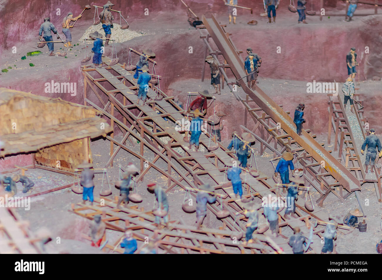 Phuket, Thailand - February 21, 2017: Tin mining dolls models shown the ...