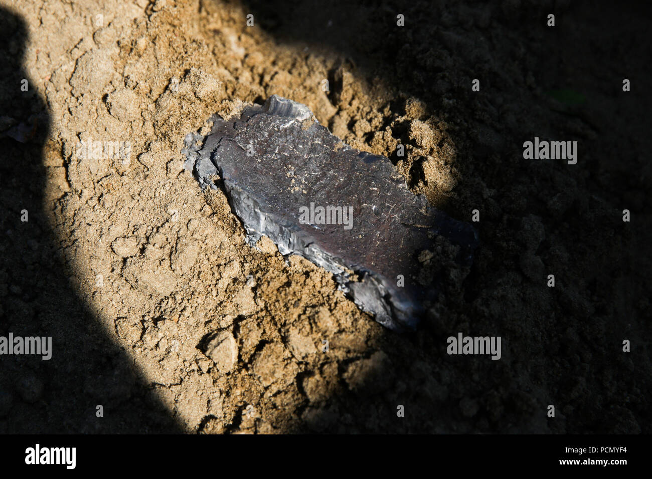 03 August 2018, Germany, Potsdam: A fragment of the bomb lies next to ...